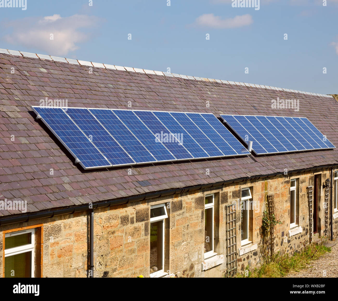 A roof mounted photovoltaic panel system Stock Photo - Alamy
