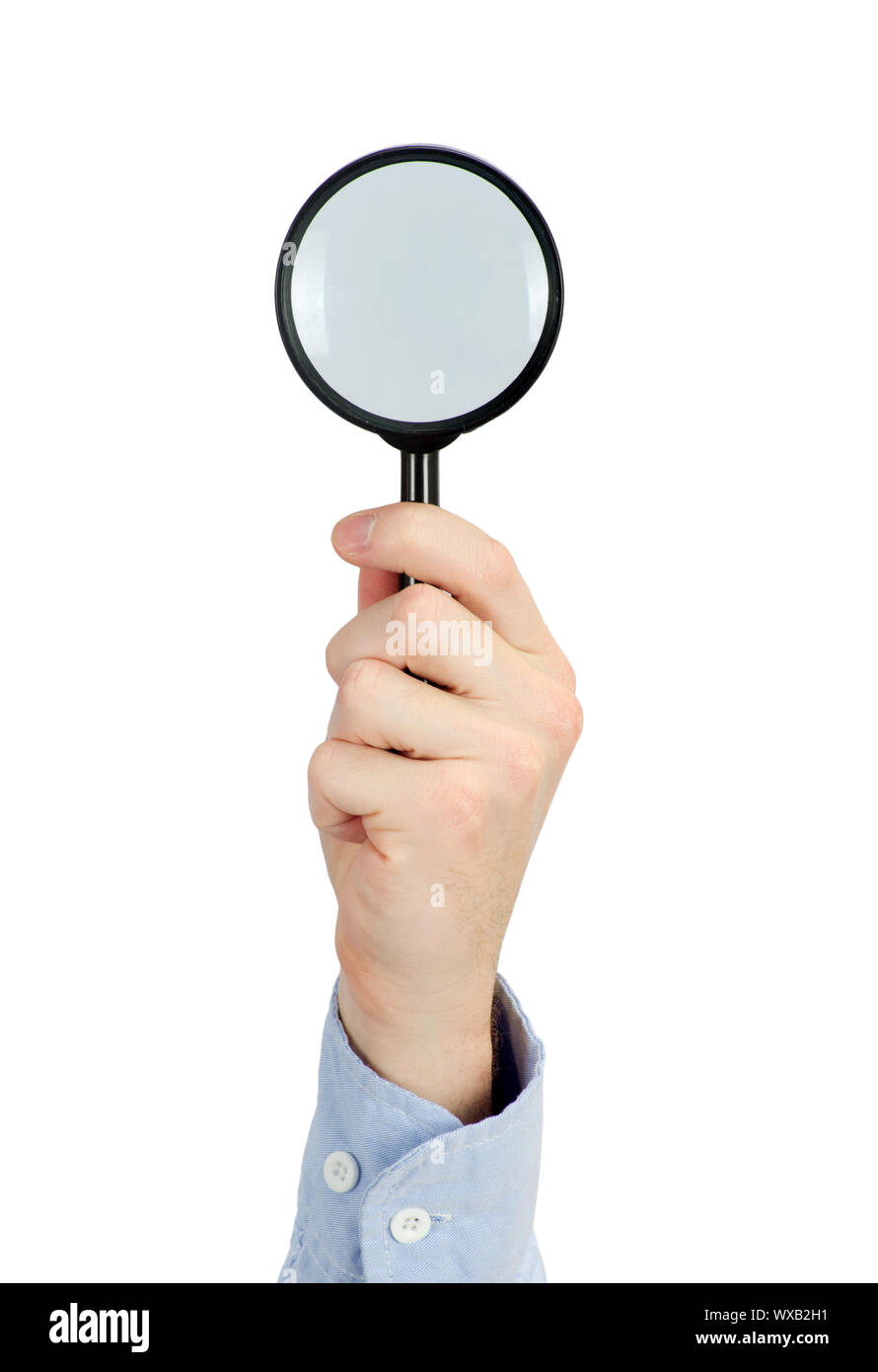 Man's hand holding magnifying glass Stock Photo - Alamy