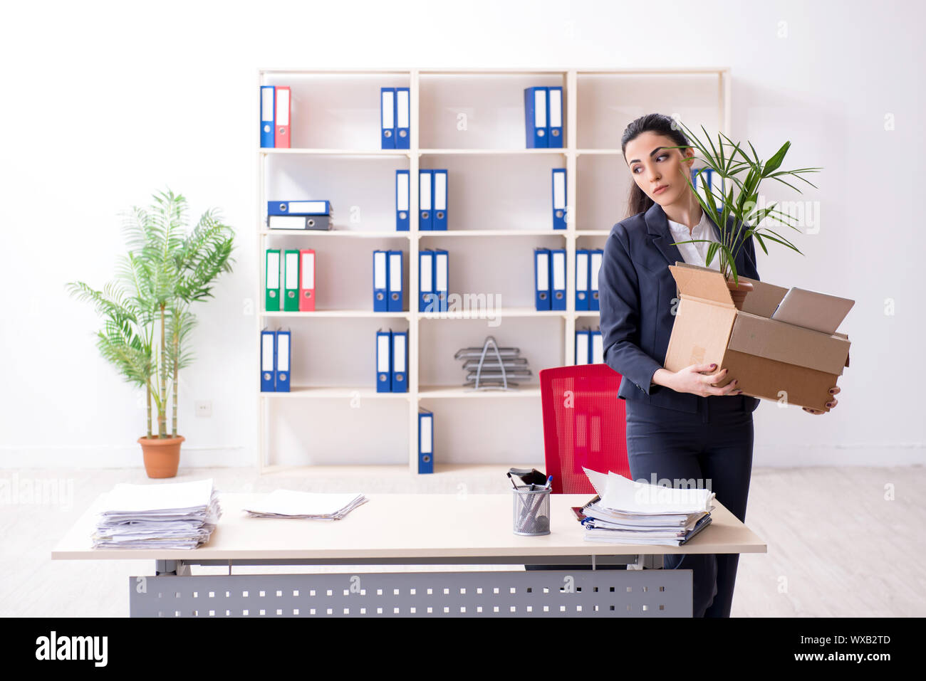 Young female employee being fired from her work Stock Photo - Alamy
