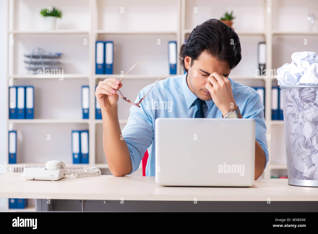 Businessman rejecting new ideas with lots of papers Stock Photo - Alamy
