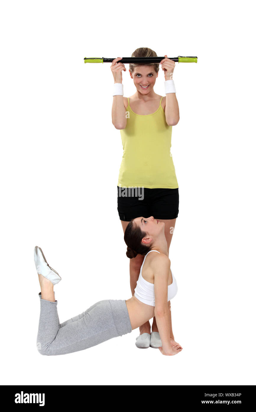 two girlfriends training together in the gym Stock Photo - Alamy