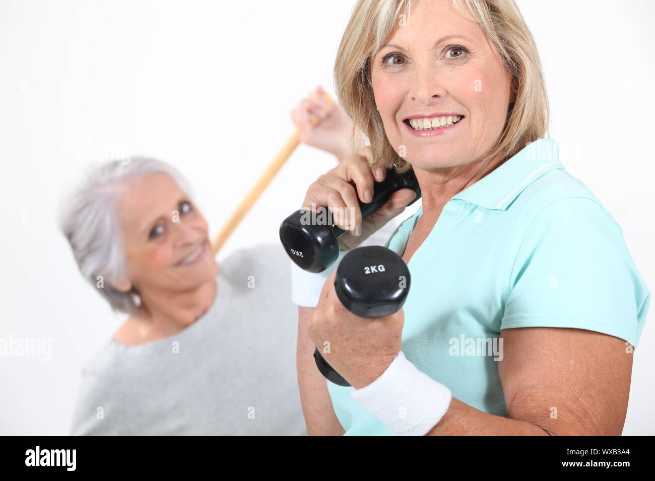 Two middle aged women working out Stock Photo - Alamy