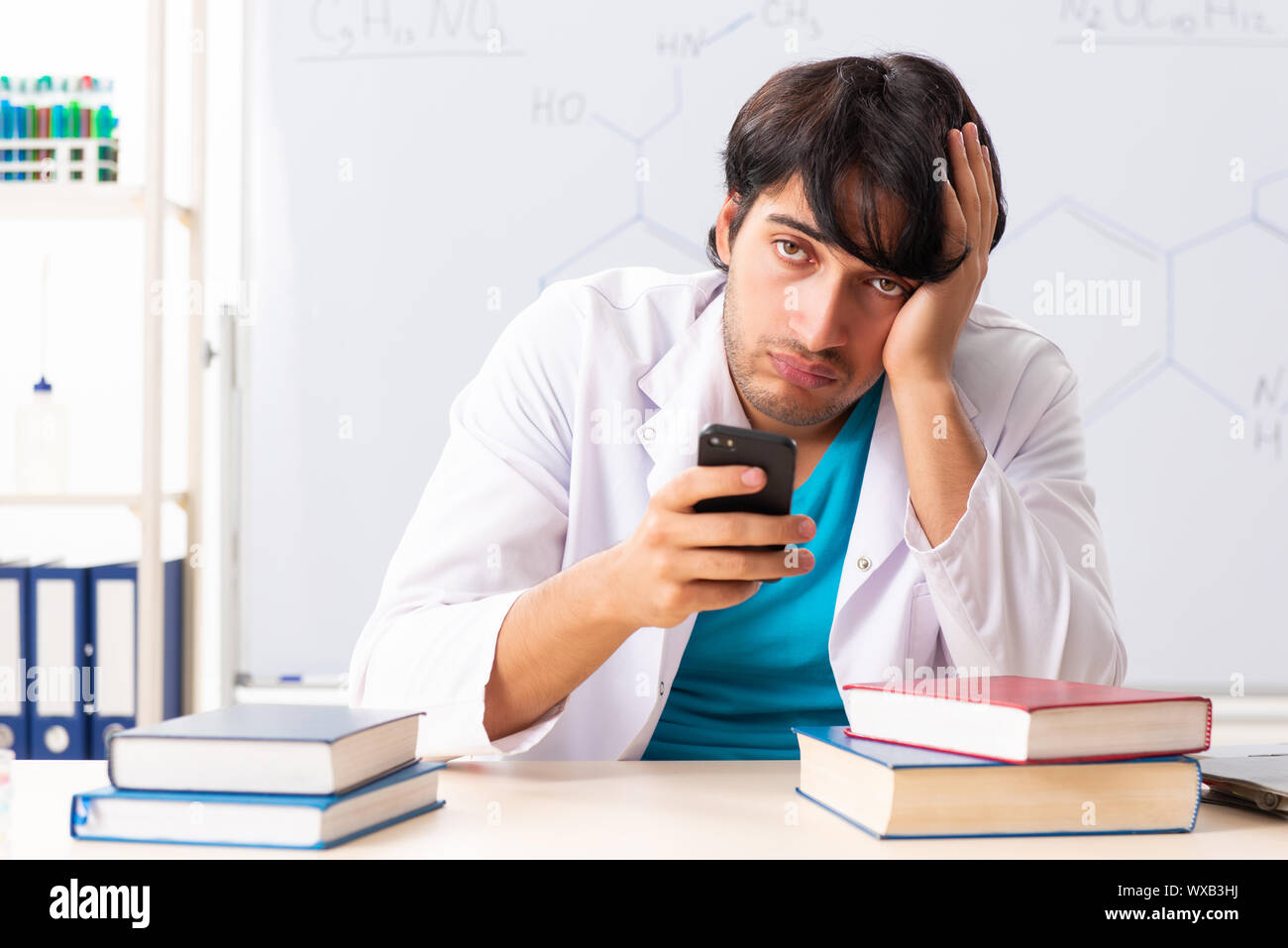 High school student texting in class hi-res stock photography and ...