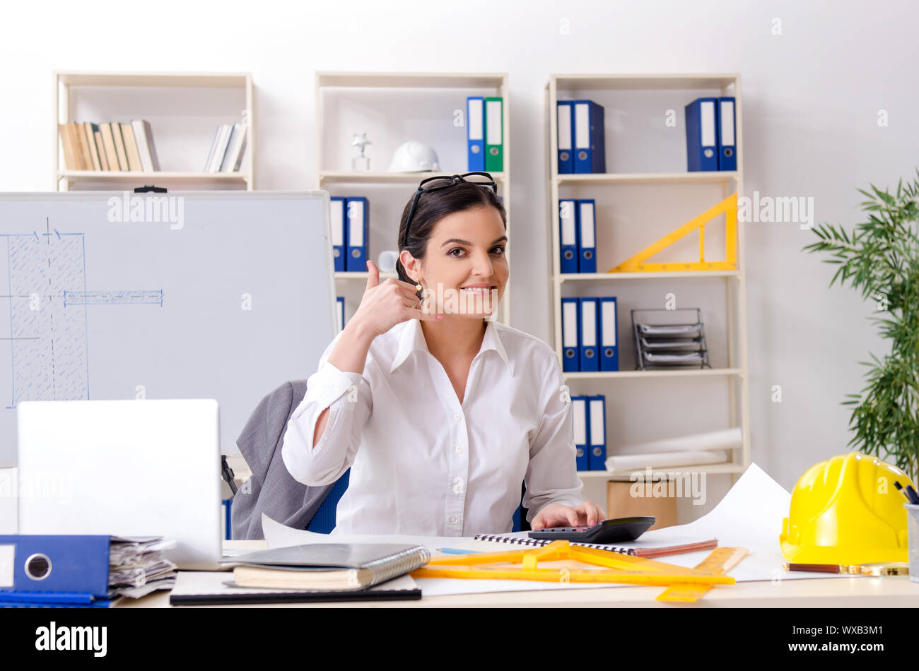 Female architect working in the office Stock Photo - Alamy