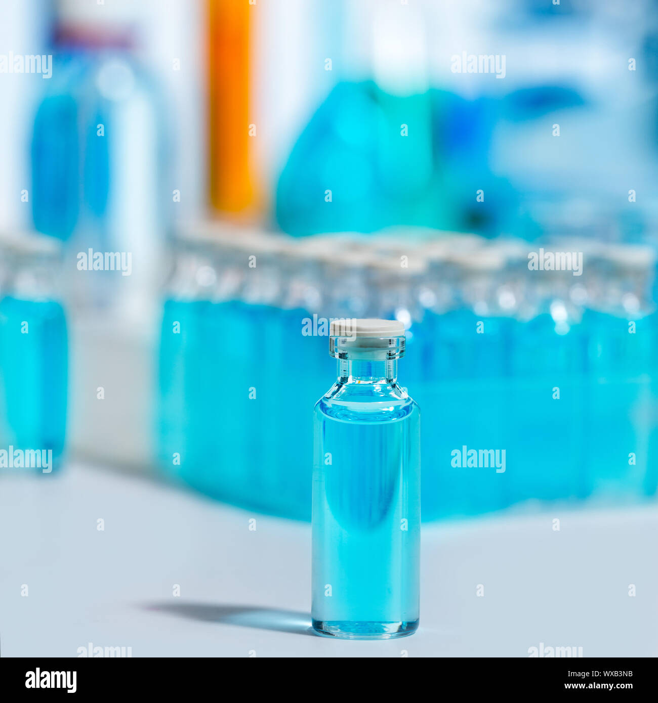 Chemical scientific laboratory stuff test tube and blue glass bottles ...