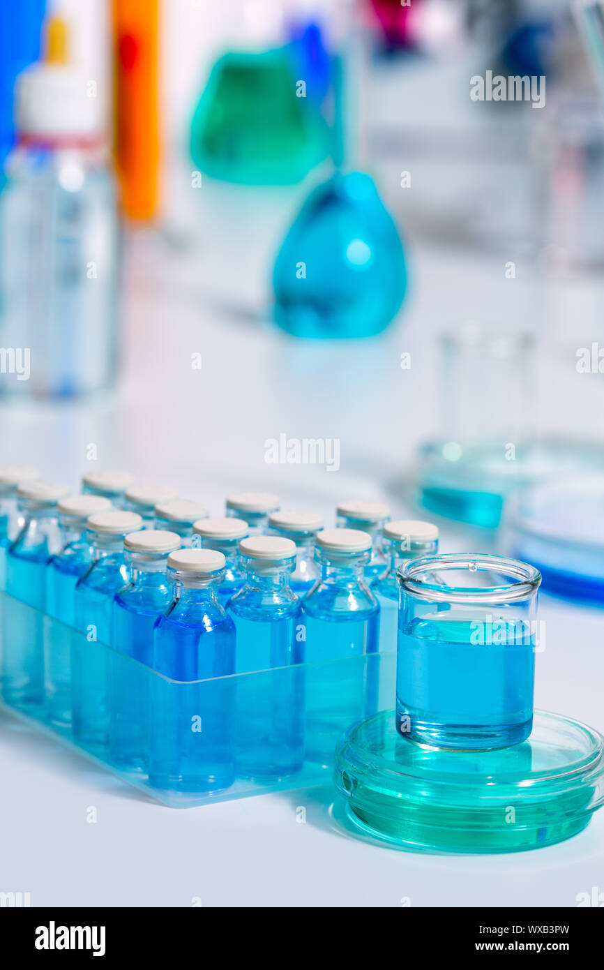 Chemical scientific laboratory stuff test tube and blue glass bottles ...