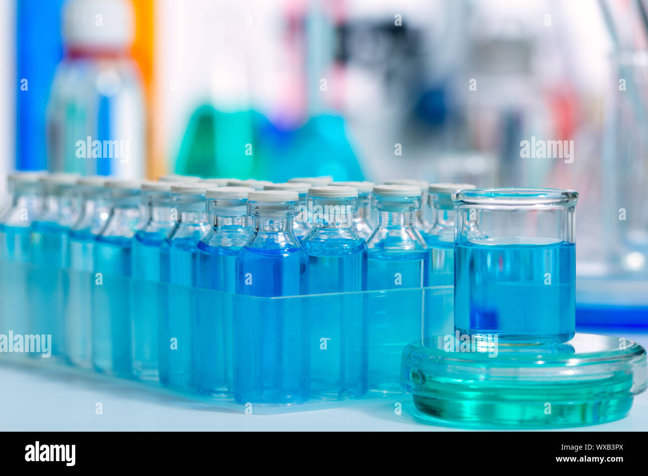 Chemical scientific laboratory stuff test tube and blue glass bottles ...