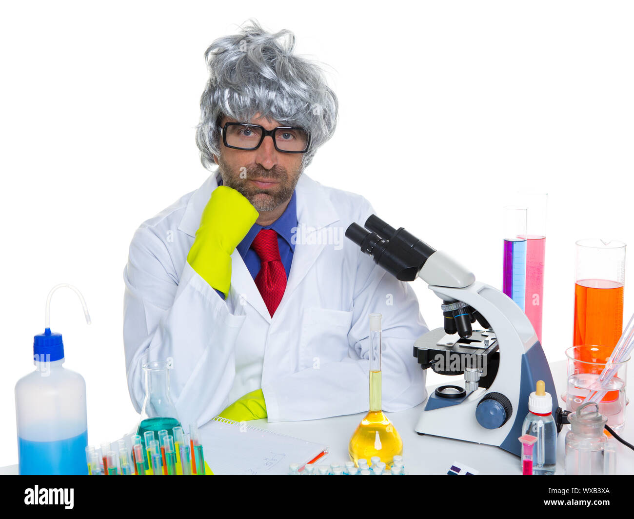 Carzy pensive nerd scientist at chemical laboratory thinking with ...