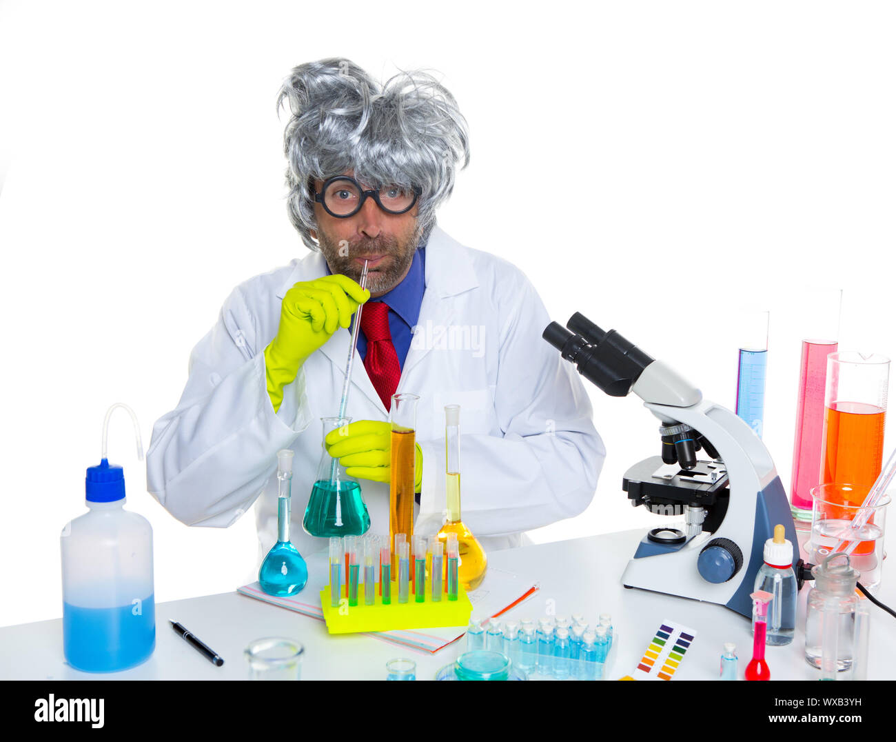 Crazy silly nerd scientist drinking chemical experiment liquid at ...