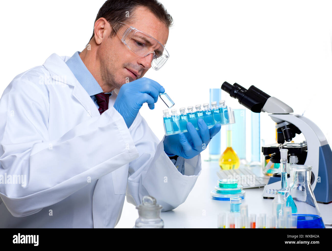 laboratory scientist working at lab with test tubes and microscope ...