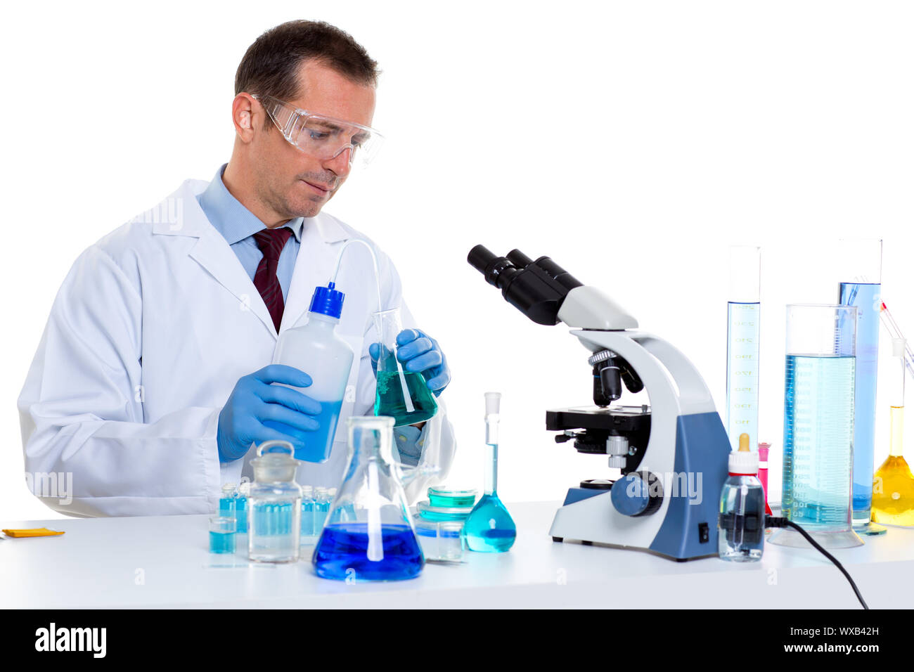 laboratory scientist working at lab with test tubes and microscope ...
