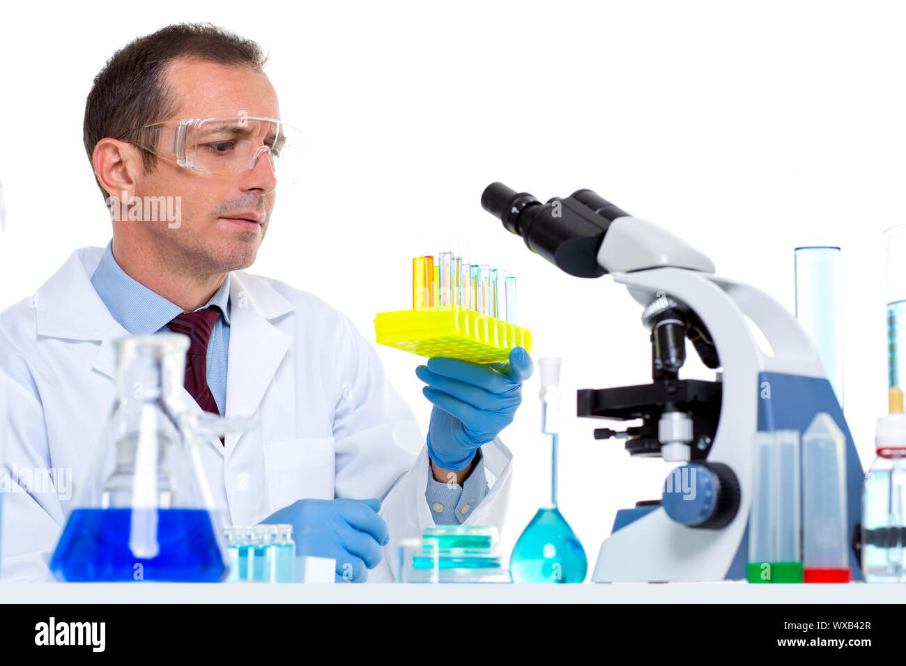 laboratory scientist working at lab with test tubes and microscope ...
