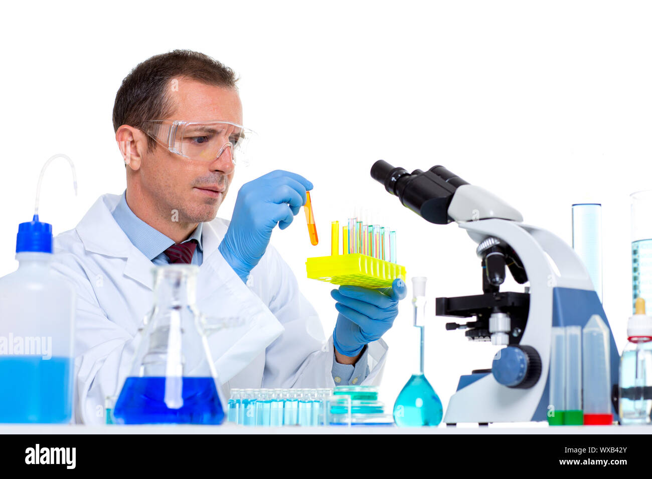 laboratory scientist working at lab with test tubes and microscope ...