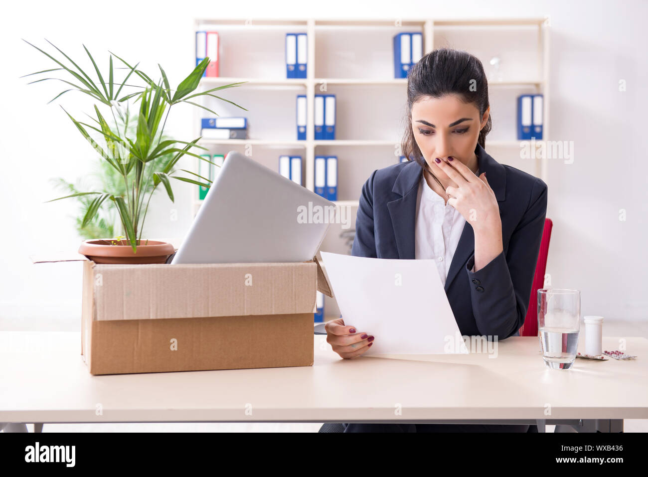 Young female employee being fired from her work Stock Photo - Alamy