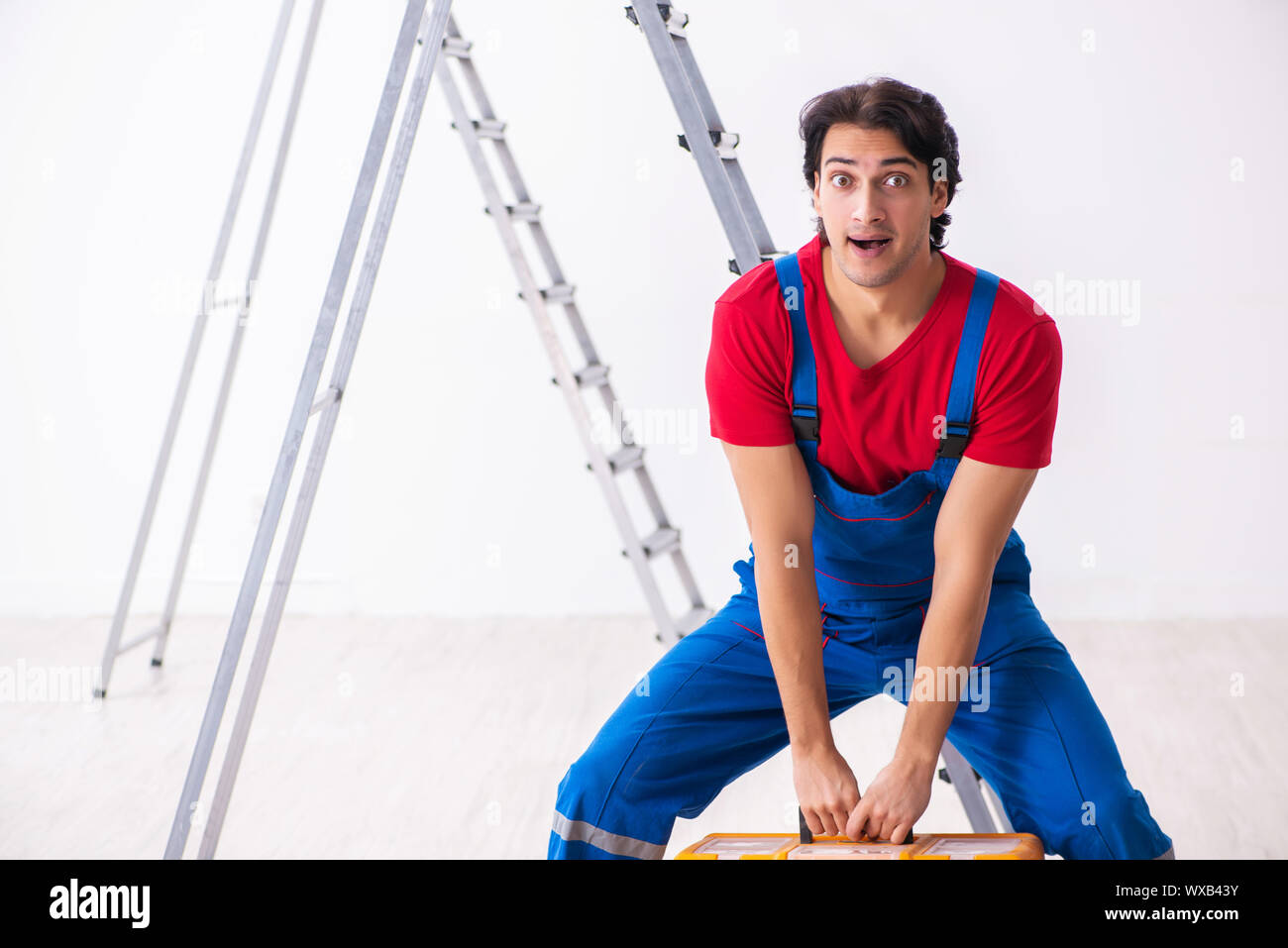 Young handsome contractor working hi-res stock photography and images ...