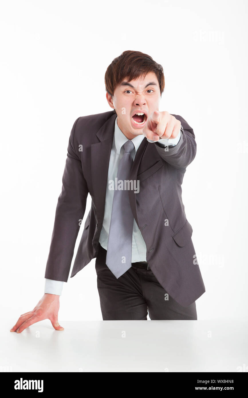 Angry businessman pointing you Stock Photo - Alamy