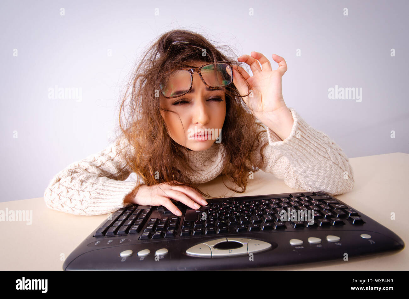 Funny nerd girl working on computer Stock Photo - Alamy