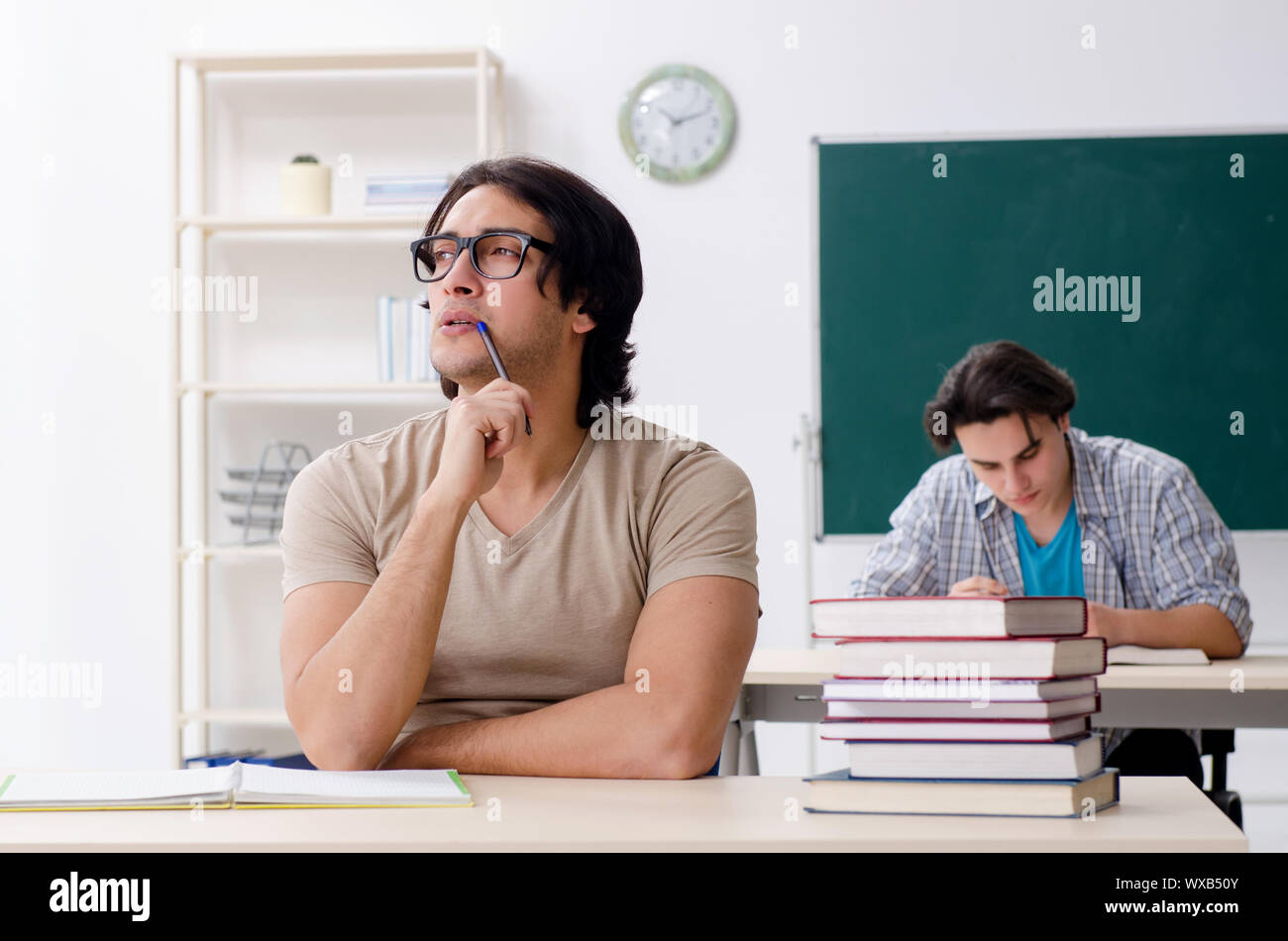Two male students in the classroom Stock Photo - Alamy