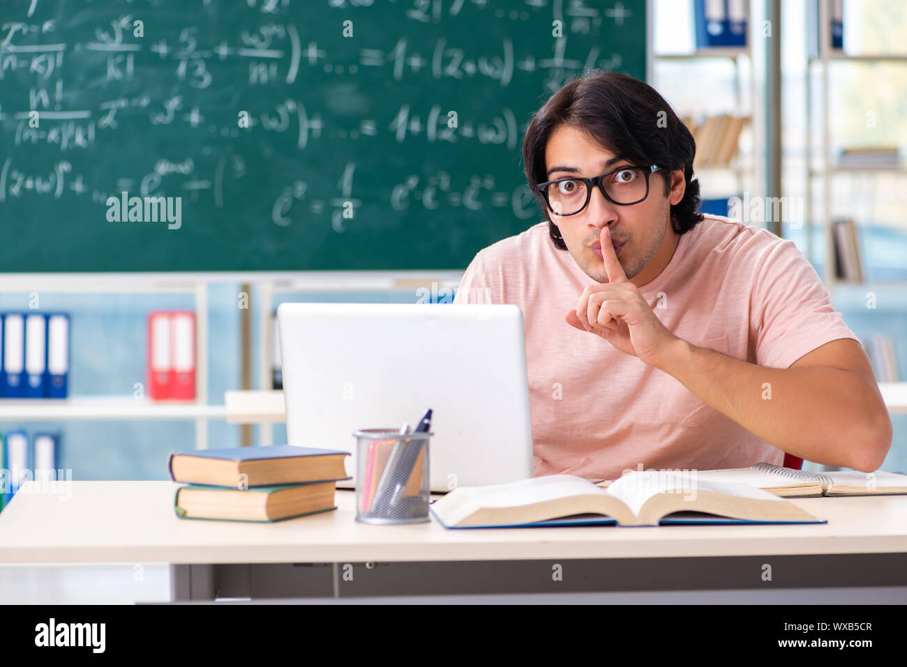 Young male student in the classroom Stock Photo - Alamy