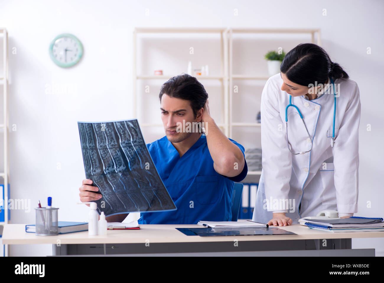 Two young doctors working in the clinic Stock Photo - Alamy