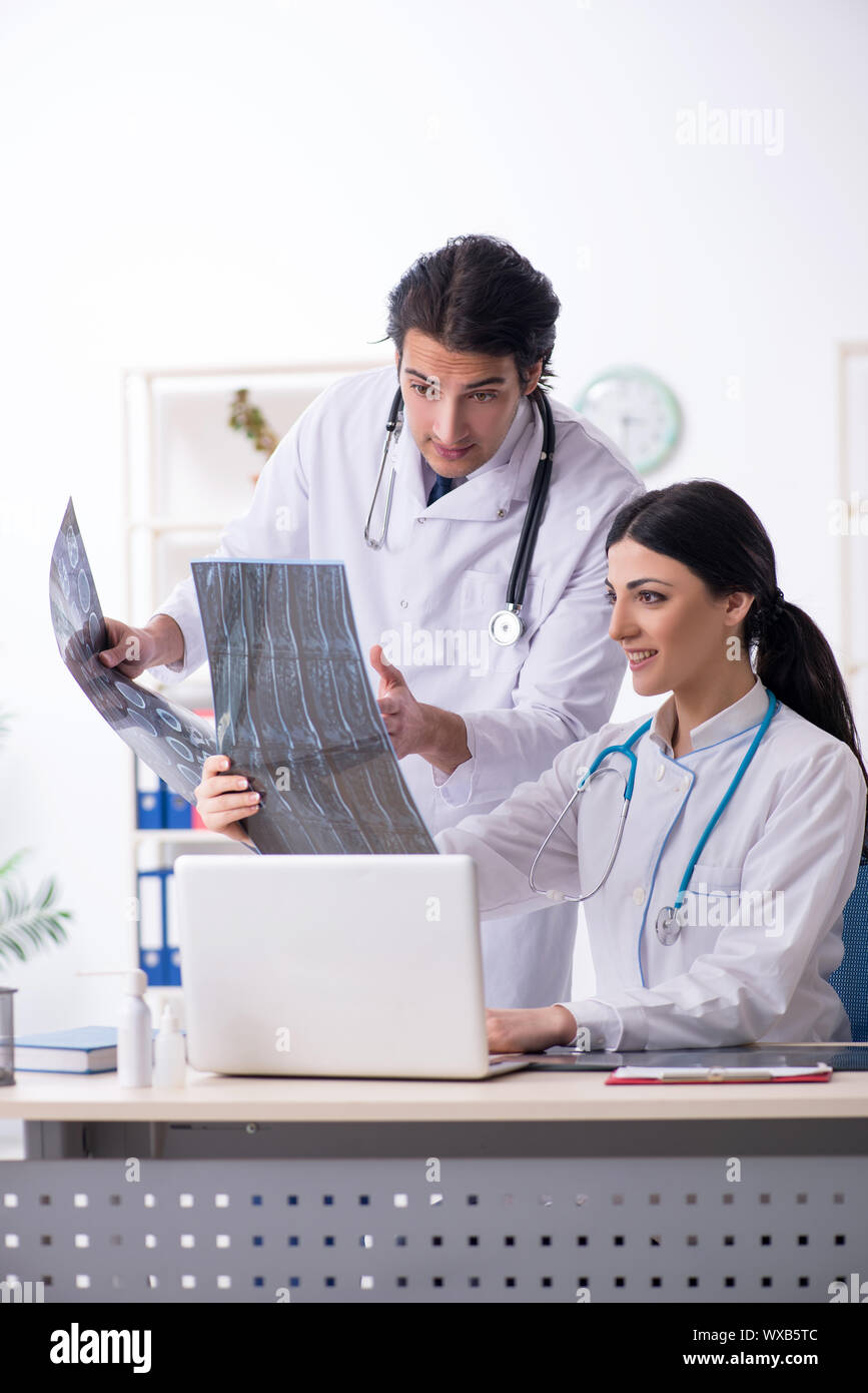 Two young doctors working in the clinic Stock Photo - Alamy