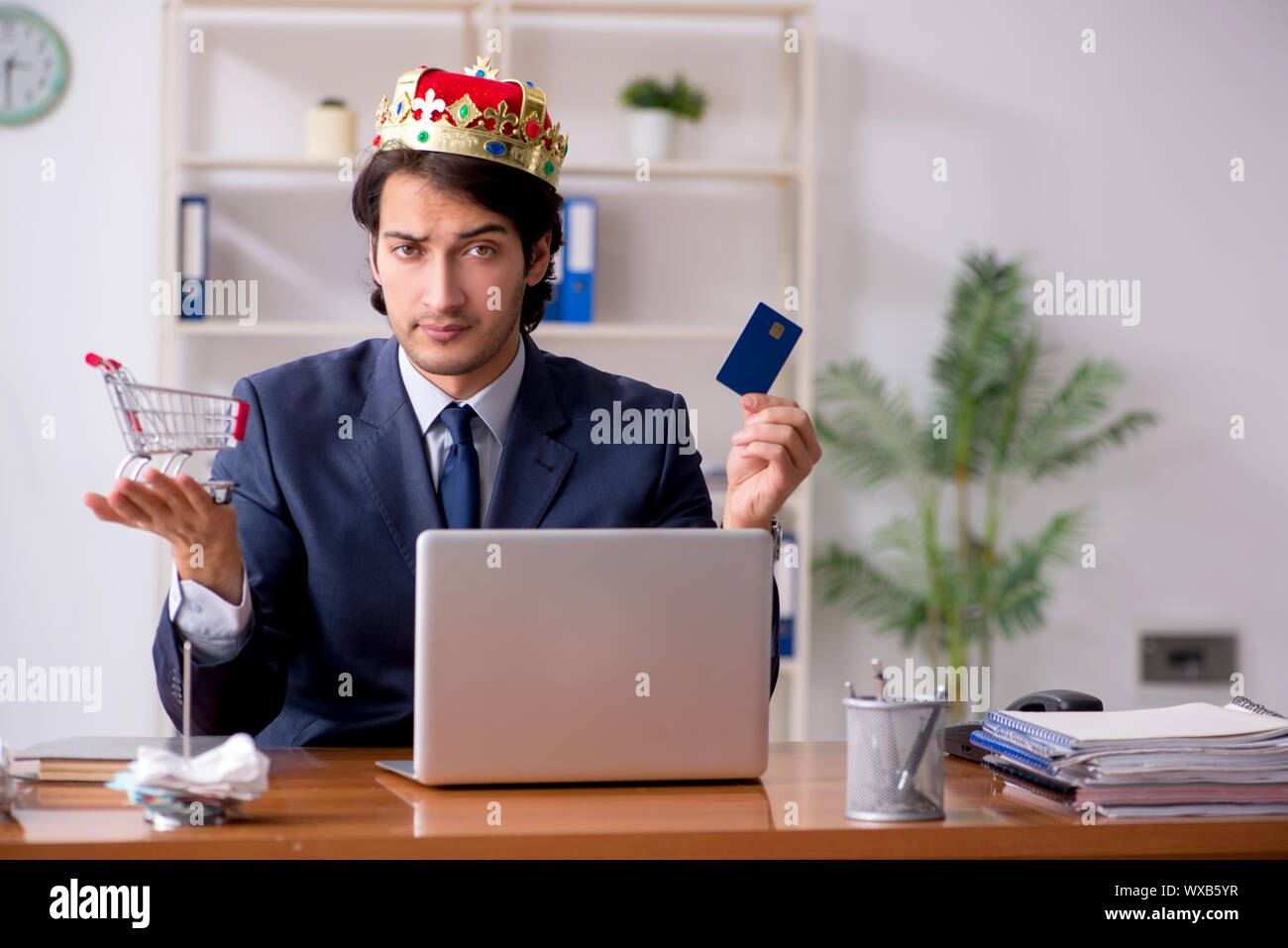 Young king businessman working in the office Stock Photo - Alamy