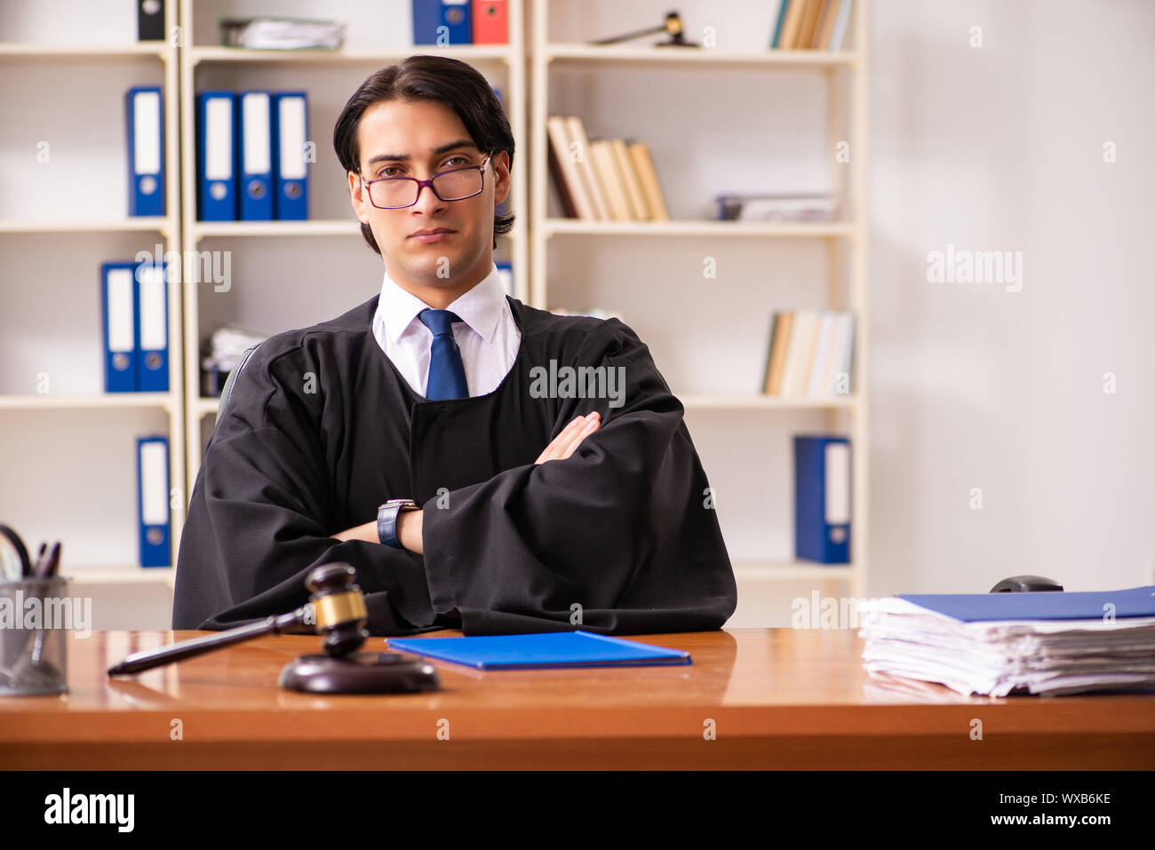 Young handsome judge working in court Stock Photo - Alamy