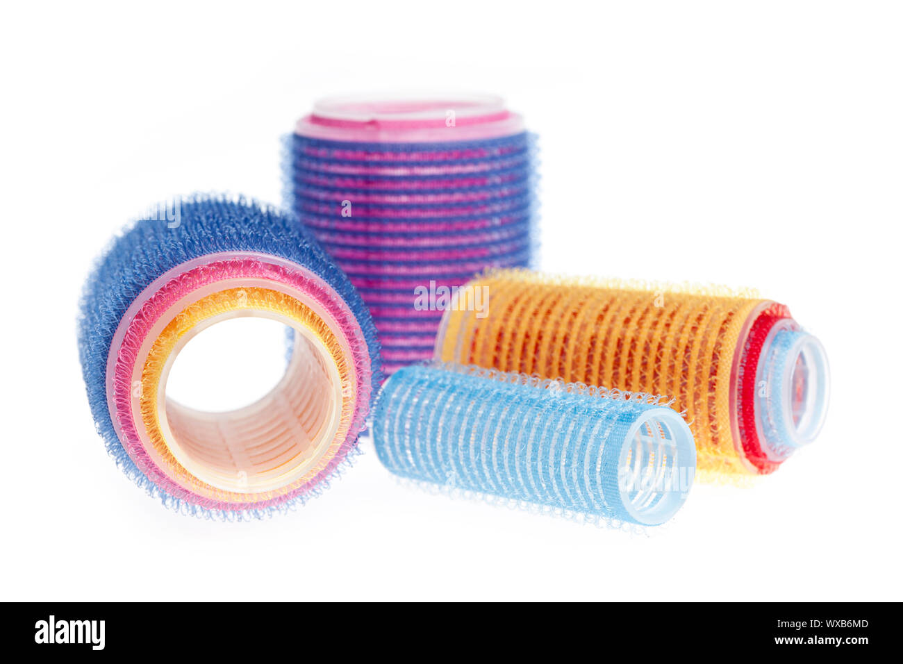 Colorful hair rollers isolated on white background Stock Photo - Alamy