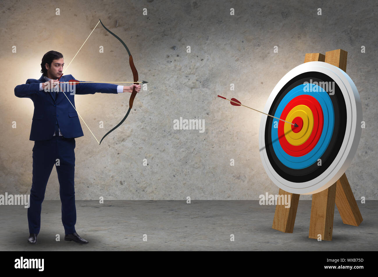 Businessman aiming arrow with bow Stock Photo - Alamy