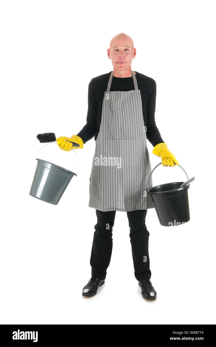Cleaner with bucket and dustpan and brush standing in studio Stock ...