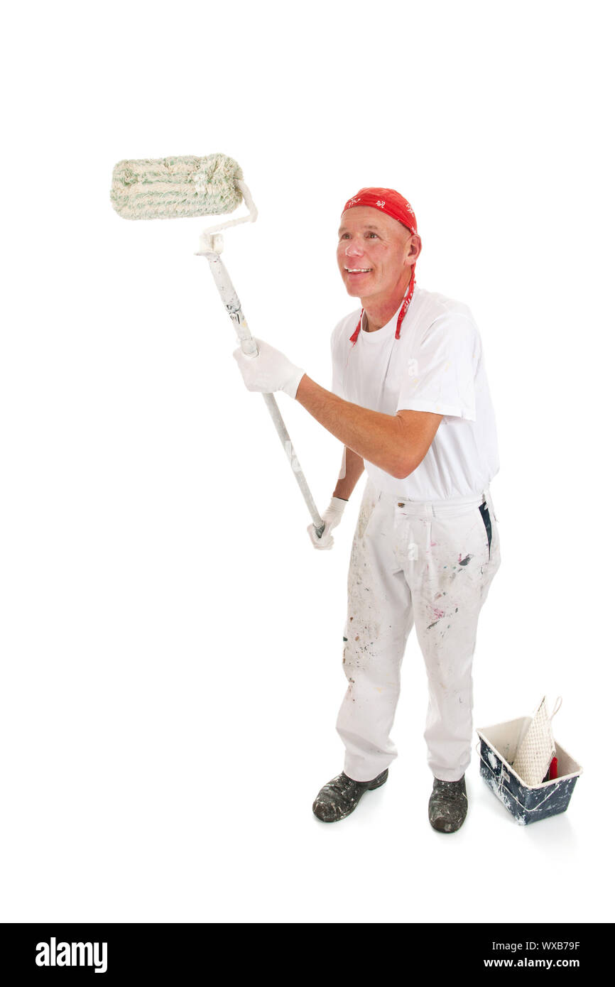 Painter painting the wall with a big roller Stock Photo - Alamy