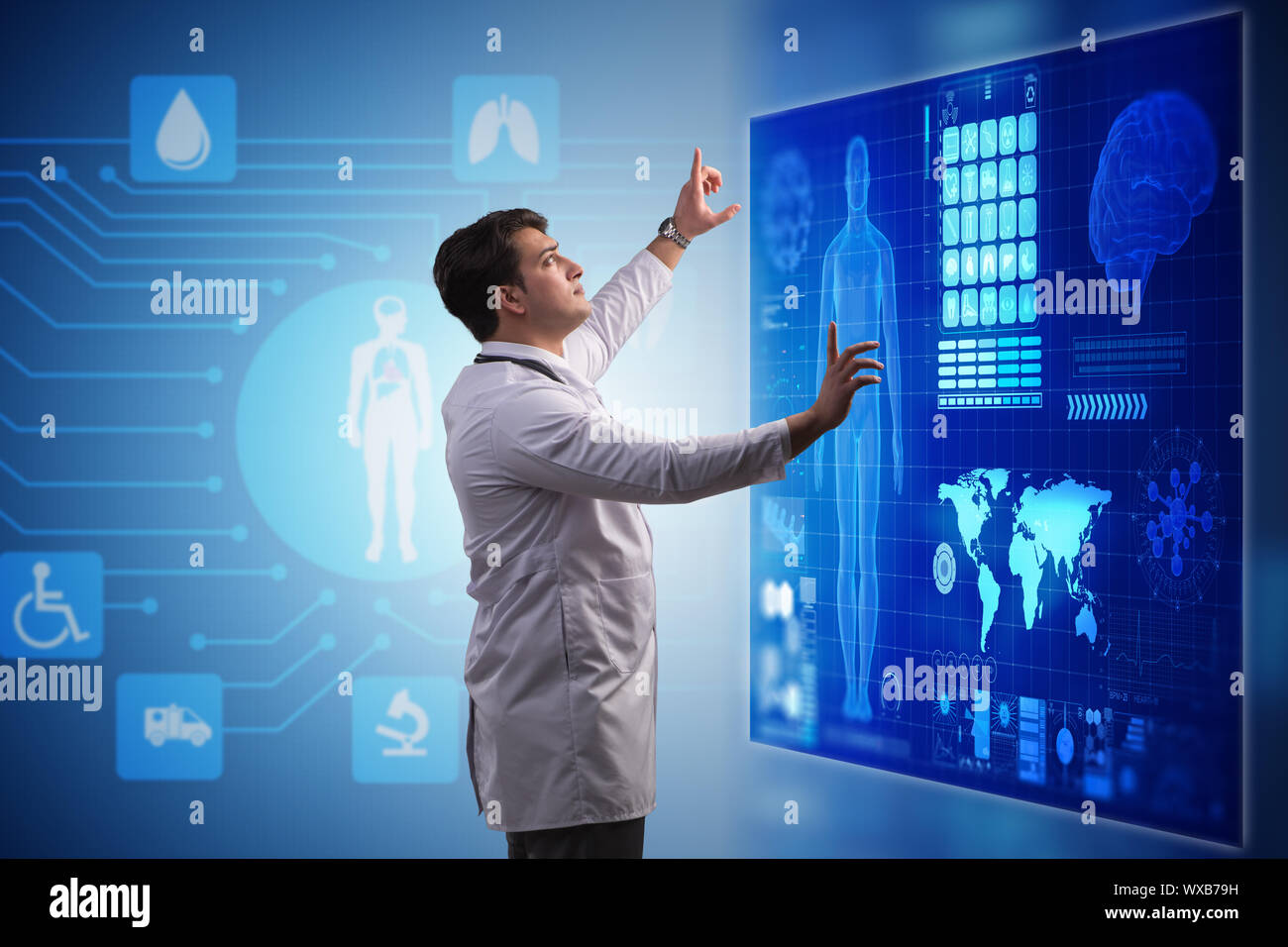 Doctor in telemedicine concept looking at screen Stock Photo - Alamy