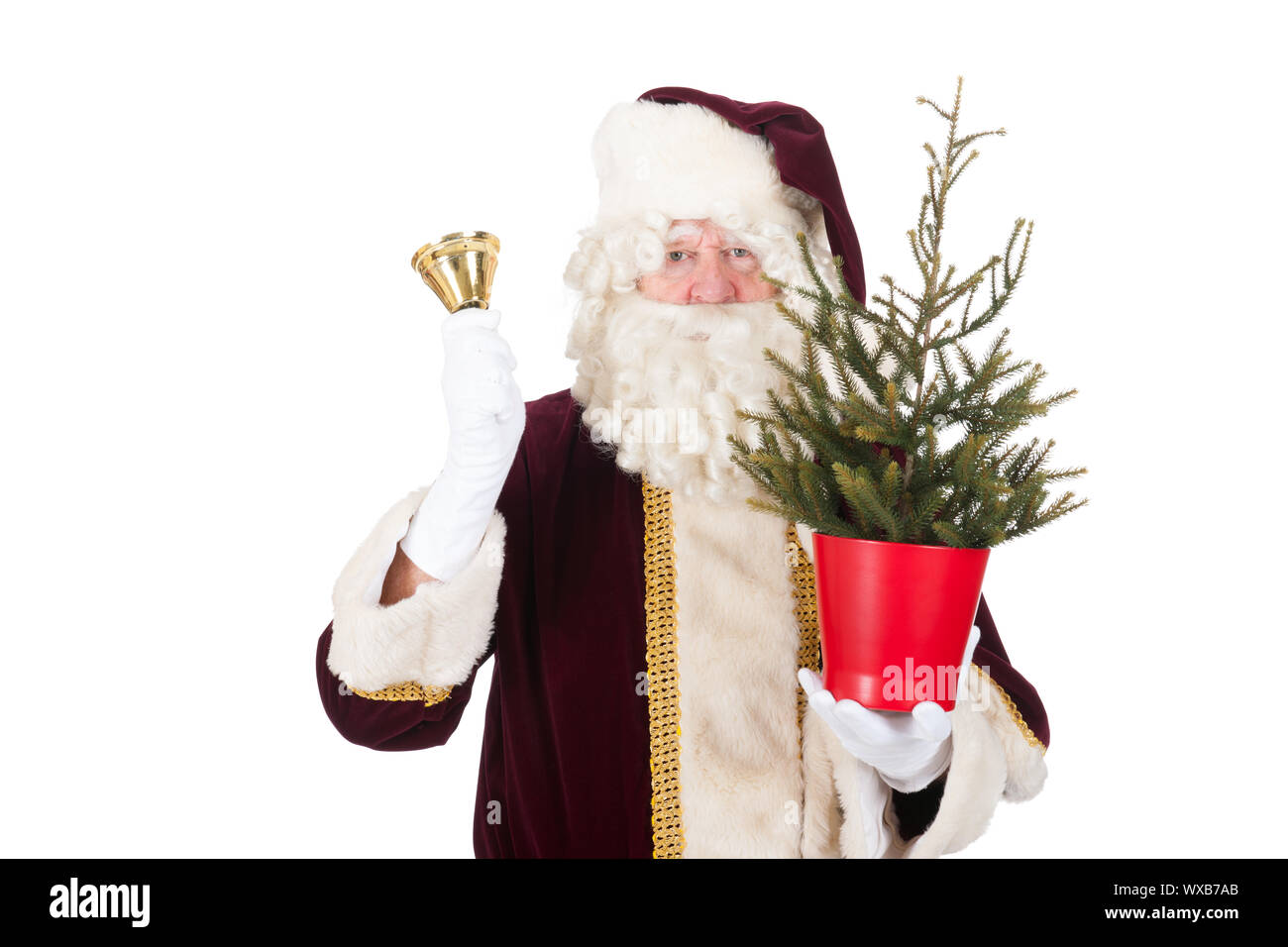 Santa Claus with Christmas tree and copper bell isolated over white ...