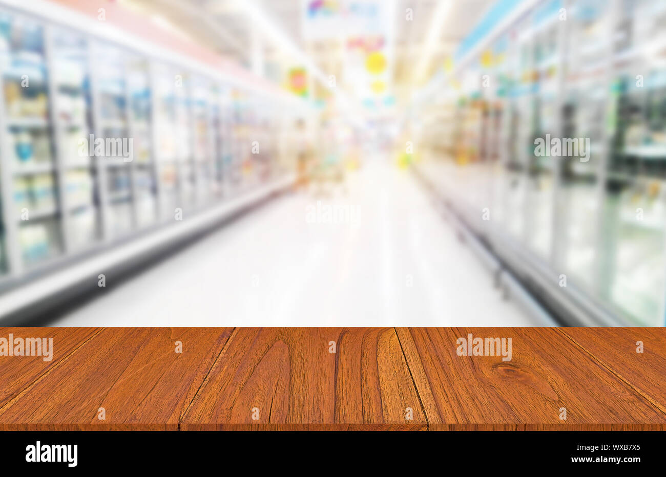 Wood table on food product shelf in supermarket, montage or display ...