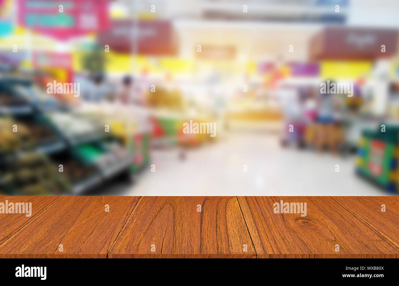 Wood table on food product shelf in supermarket, montage or display ...