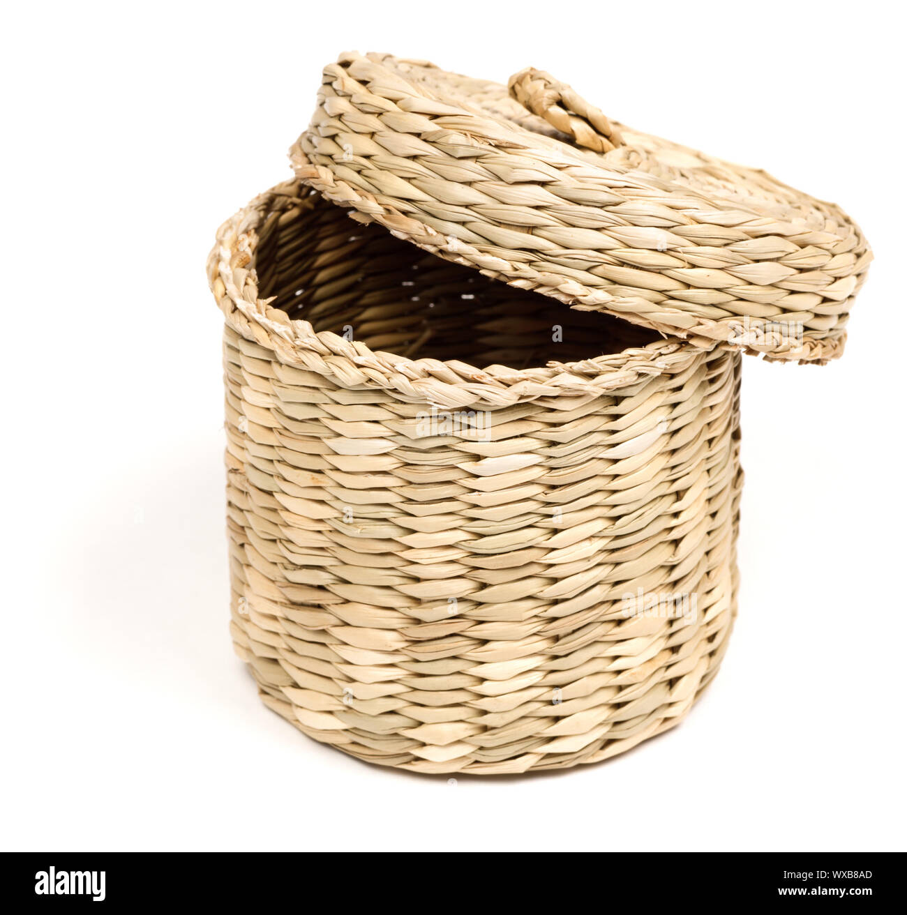 Open rattan box on white background Stock Photo - Alamy