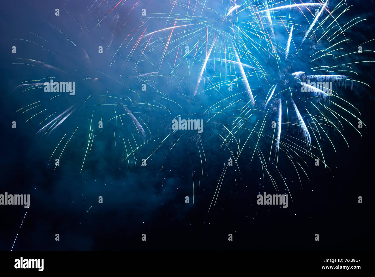 Blue holiday fireworks Stock Photo - Alamy