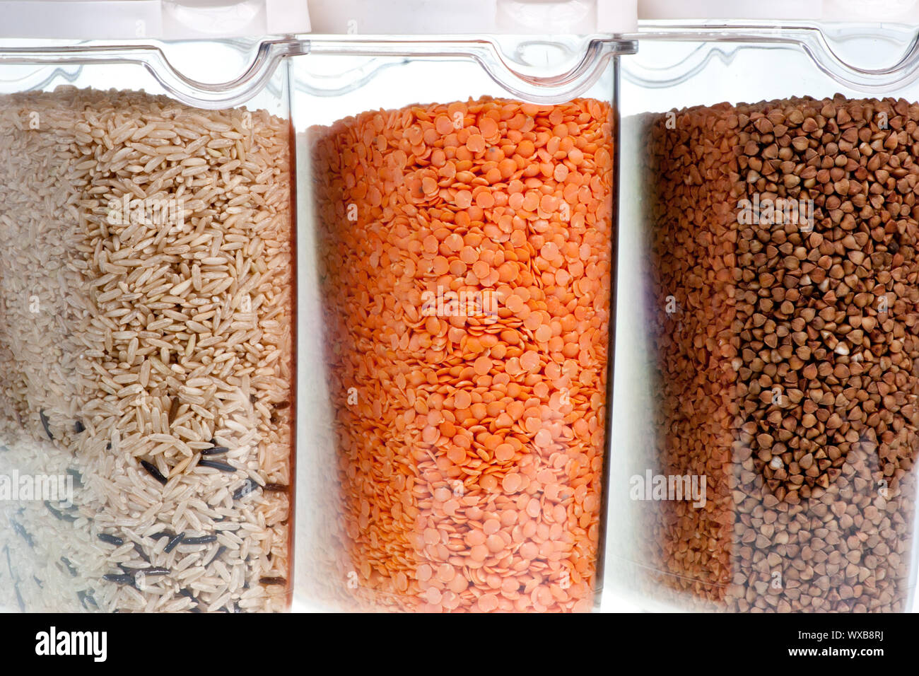 Rice red lentil and buckwheat in transparent plastic containers Stock ...
