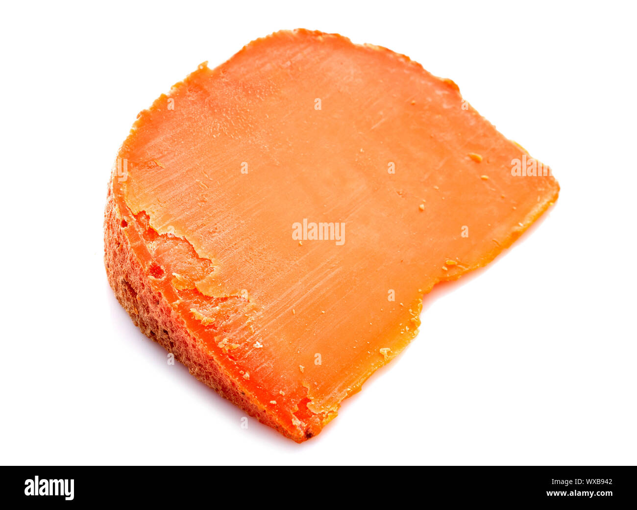 old mimolette in front of white background Stock Photo - Alamy