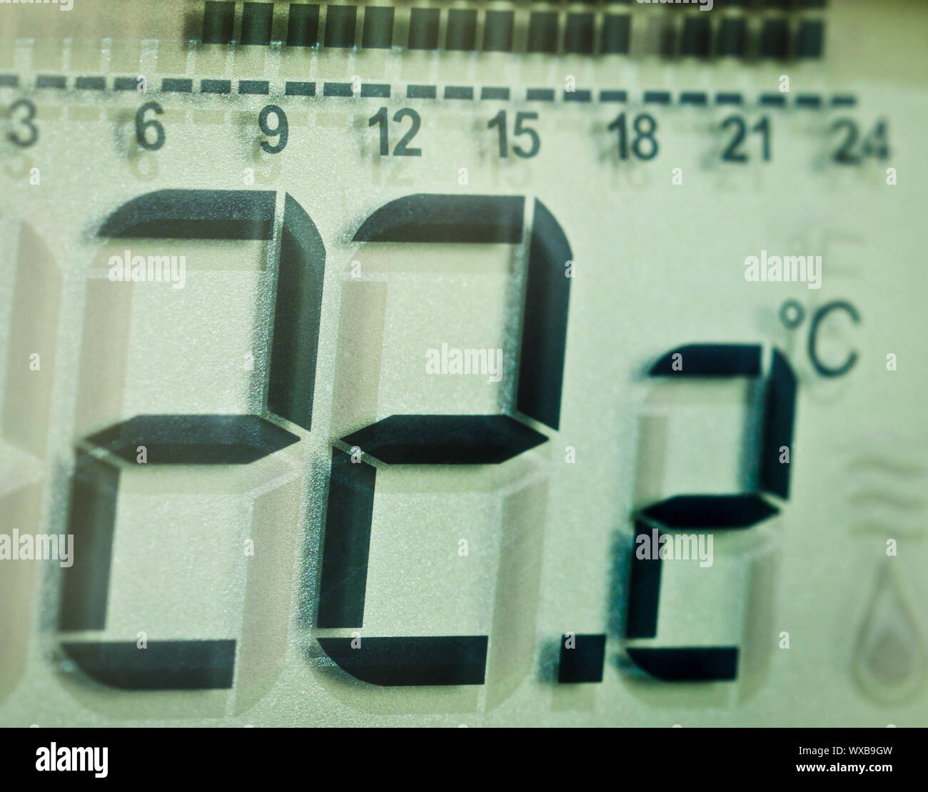 Residential digital thermostat display showing comfort room temperature ...