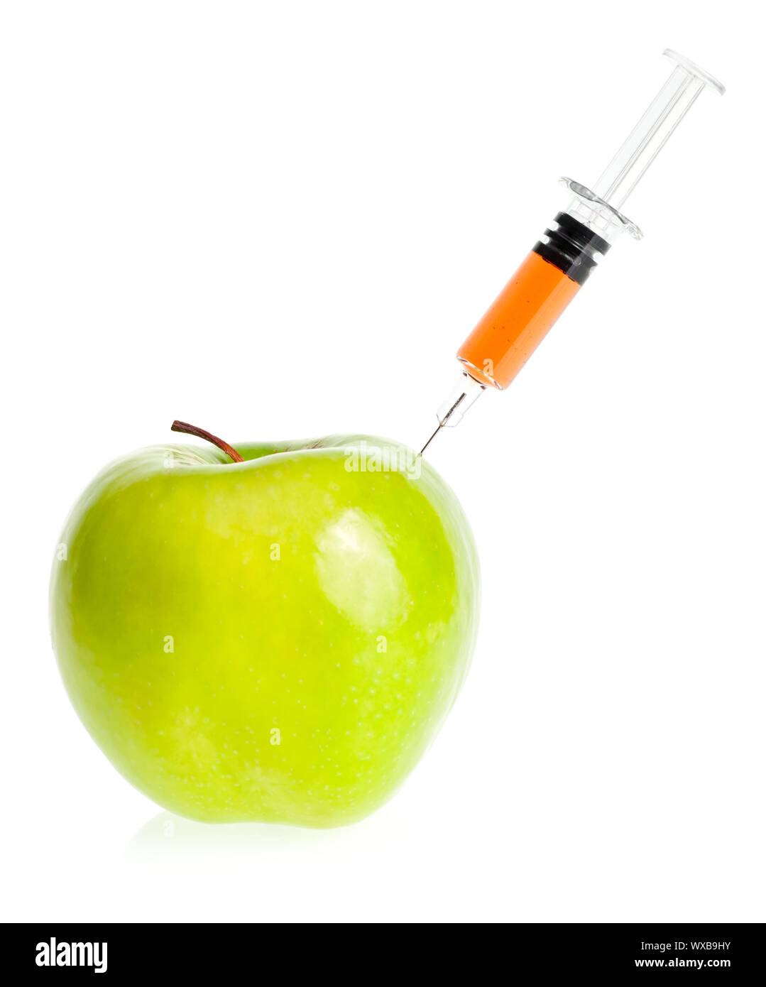 Genetic modification concept with green apple receiving an injection ...