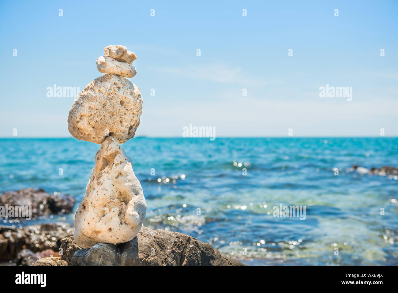 Zen stones balance at sea background Stock Photo - Alamy