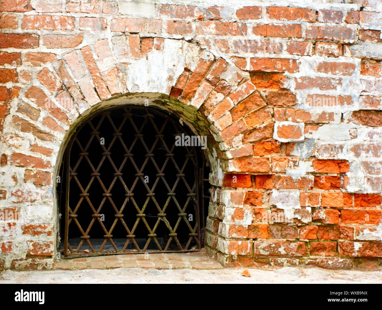 Old weathered wall with grated window Stock Photo - Alamy