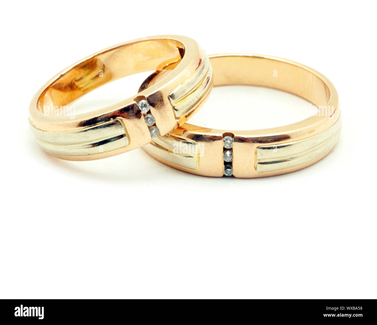 Gold wedding rings isolated on white background Stock Photo - Alamy