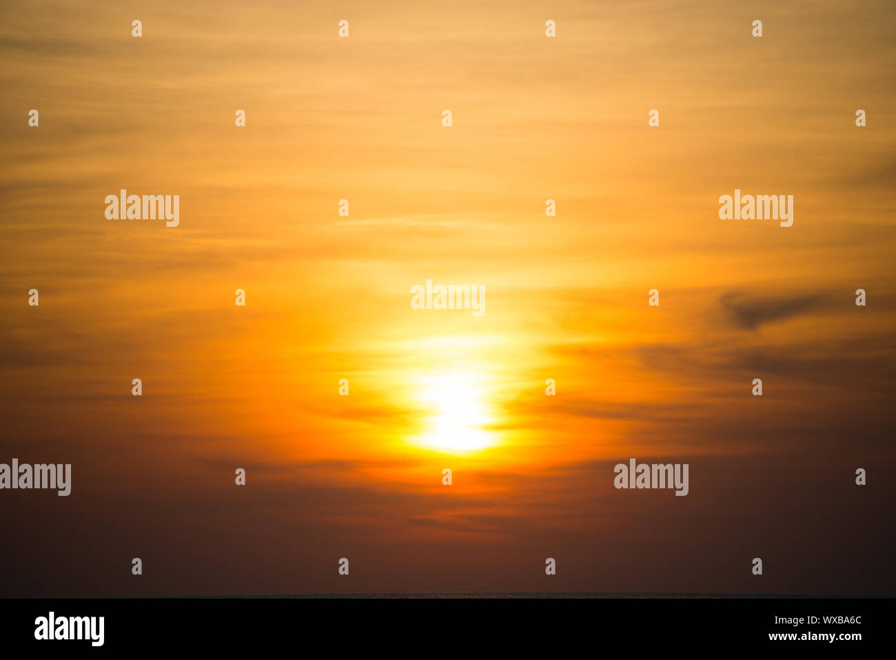 Orange dramatic sunset as background Stock Photo - Alamy