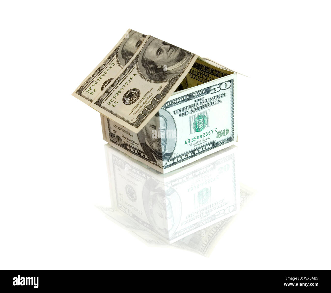Money house on white background Stock Photo - Alamy