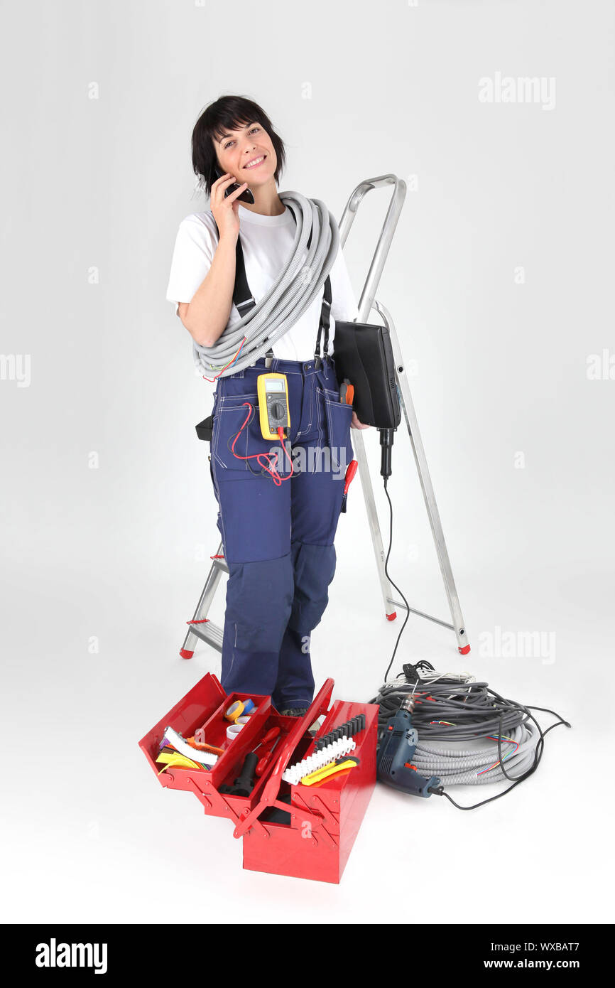 Female electrician red cable hi-res stock photography and images - Alamy