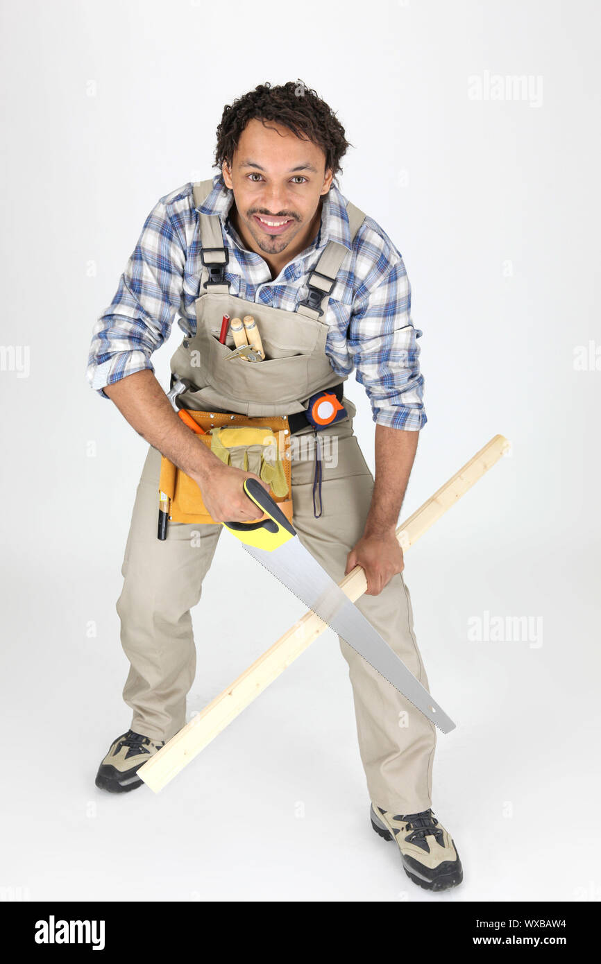 Carpenter sawing lath Stock Photo - Alamy