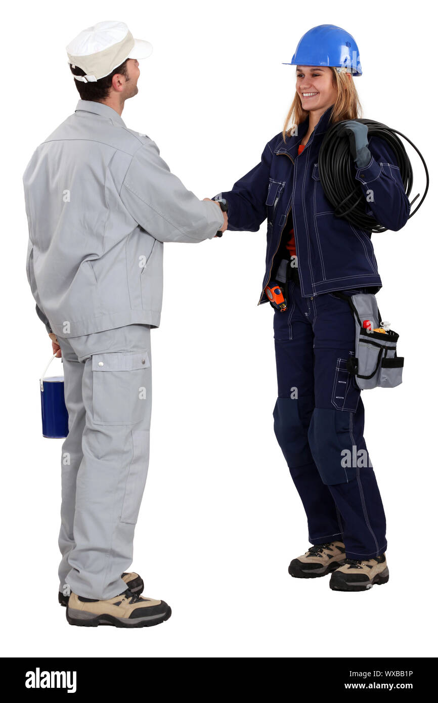 Workers greeting each other Stock Photo - Alamy