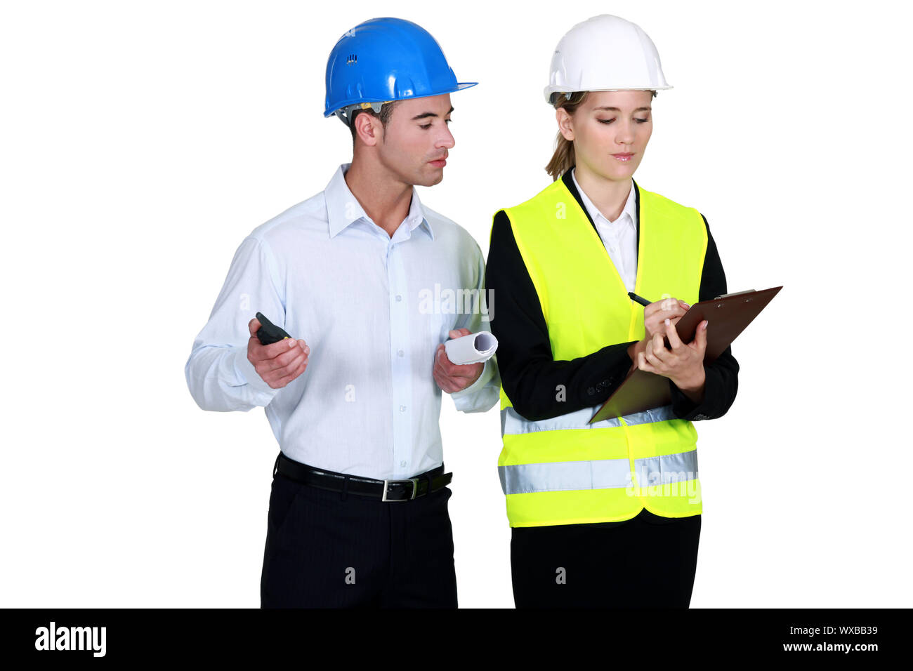 Engineer peering over shoulder Stock Photo - Alamy